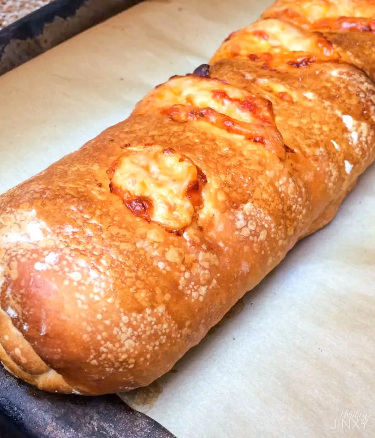 Easy Pepperoni Stromboli Recipe with Ham and Cheese - Thrifty Jinxy