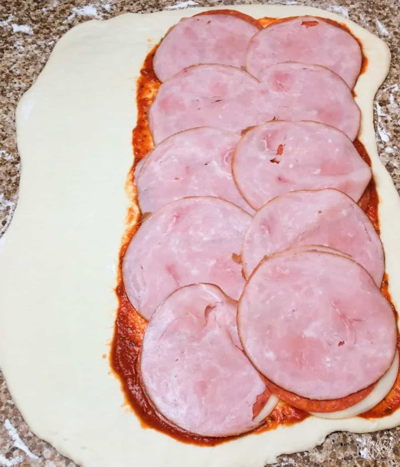 Easy Pepperoni Stromboli Recipe with Ham and Cheese - Thrifty Jinxy